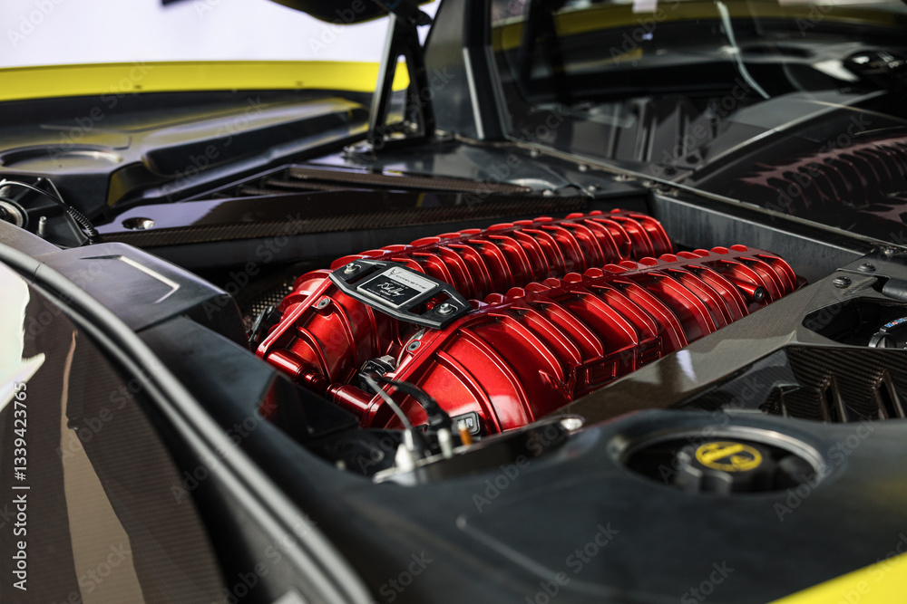 Close-up of the Corvette Z06 mid-engine bay featuring a bold red V8 ...
