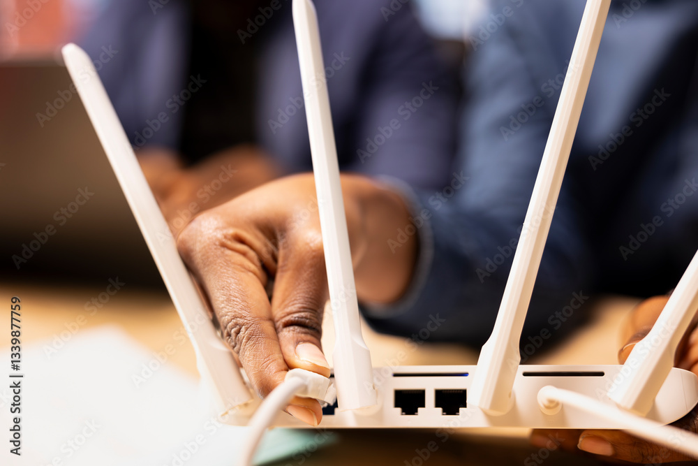 Young black woman pulling out the LAN cable from the modem while her ...