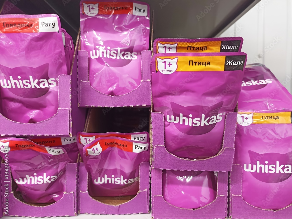 Whiskas cat food display on supermarket shelf with purple packaging and ...