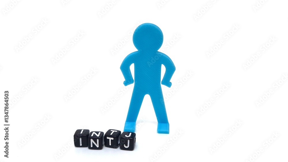black plastik cubes spelling "INTJ," with a small toy figure. INTJ is ...