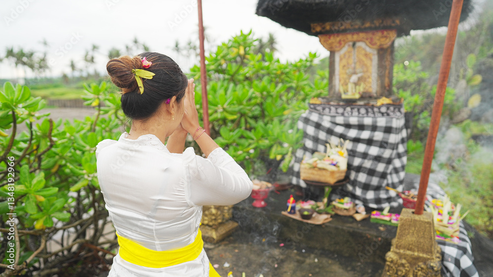 Bali woman praying at balinese temple, traditional ceremony, culture ...