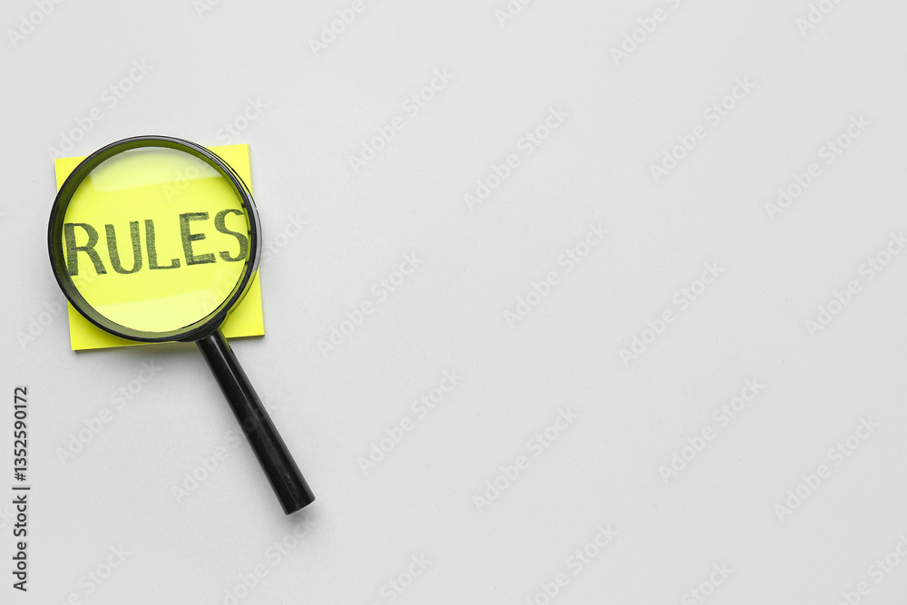 Sticky note with word RULES and magnifier on light background Stock ...