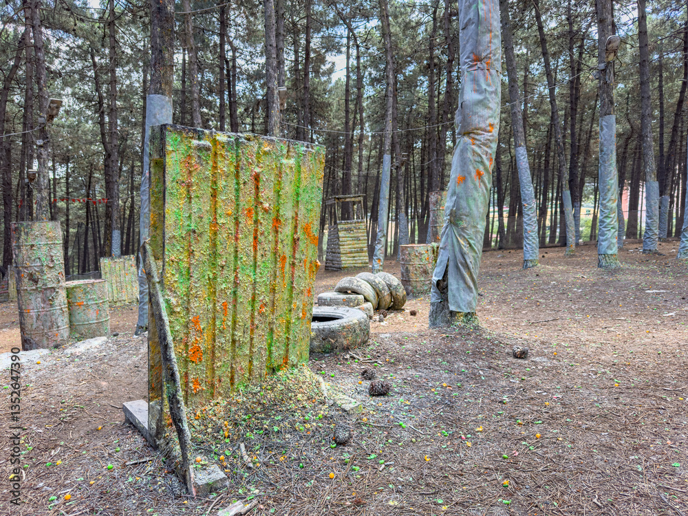Paintball field with bunkers and trees. Outdoor paintball park ...