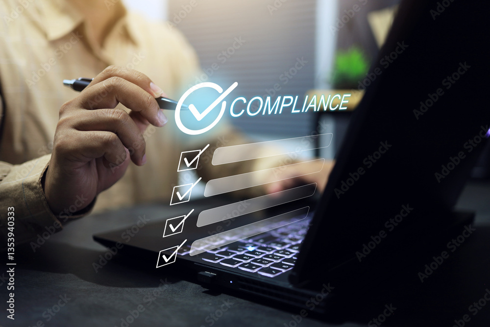 Compliance concept with businessman tick check mark with pen on laptop ...