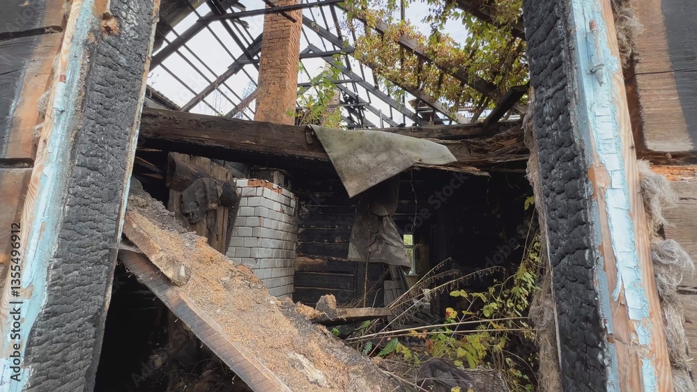 Remnants of a burnt wooden house with brick chimney revealing a tragic ...