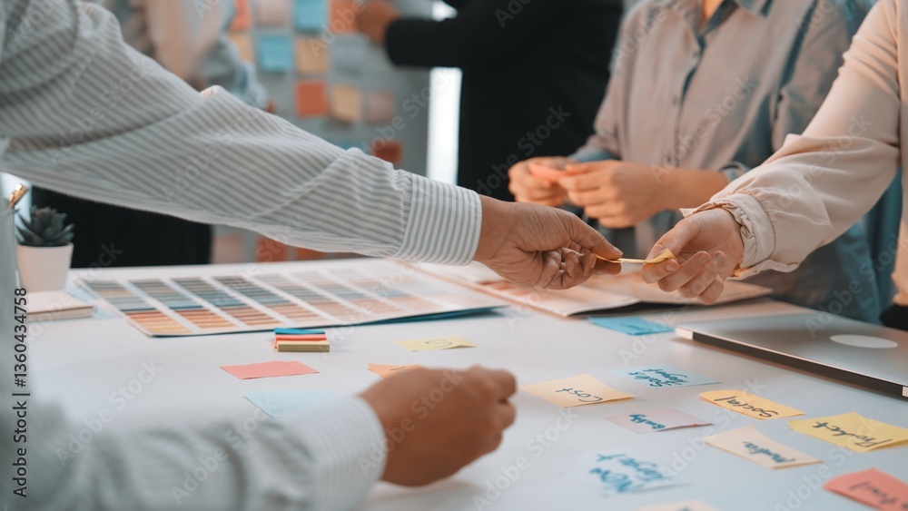 Collaborative brainstorming session with sticky notes and color ...