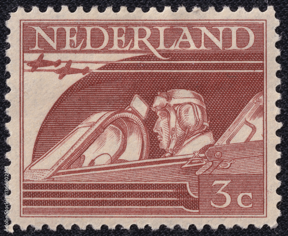 Dutch stamp issued in 1954 featuring a military pilot in cockpit with ...