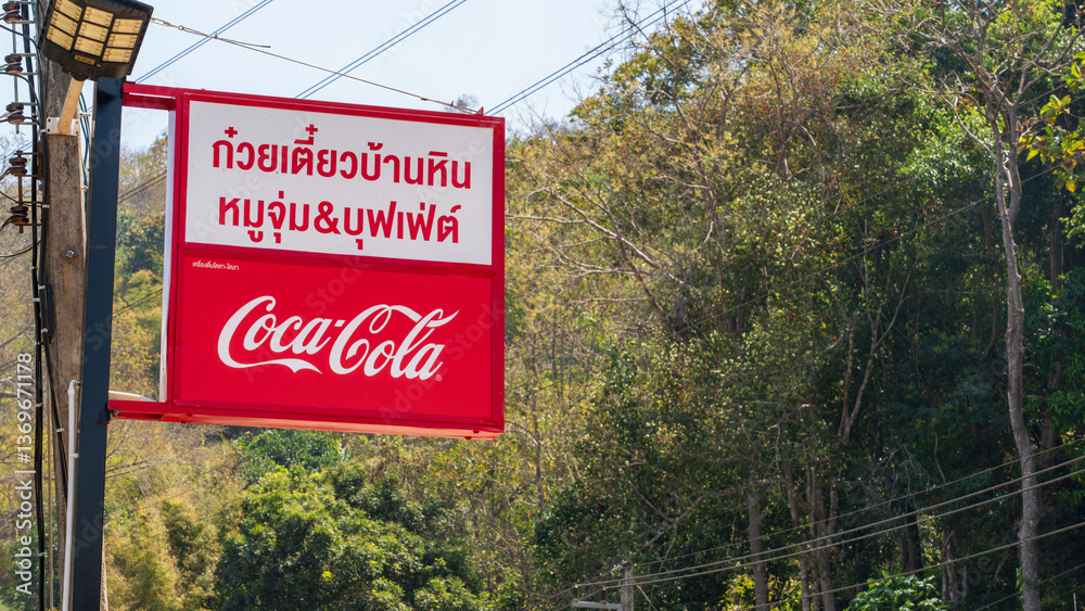 Coca-Cola signage with Thai script outside roadside eatery, 13 March ...