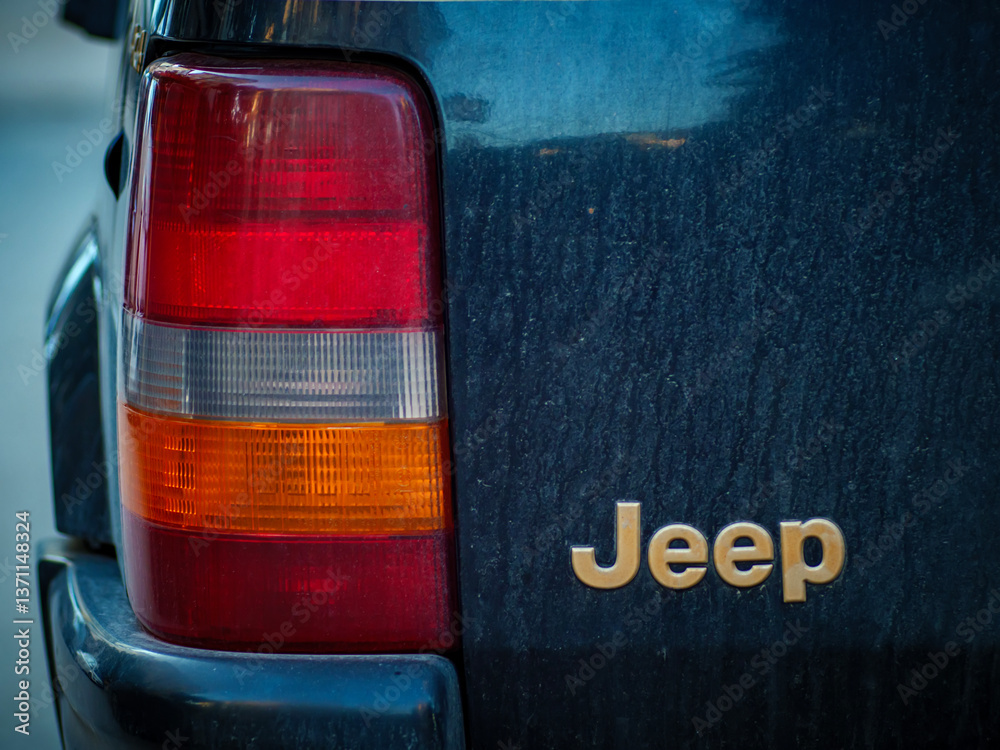 Jeep Grand Cherokee logo detail, black background, gold lettering Stock ...