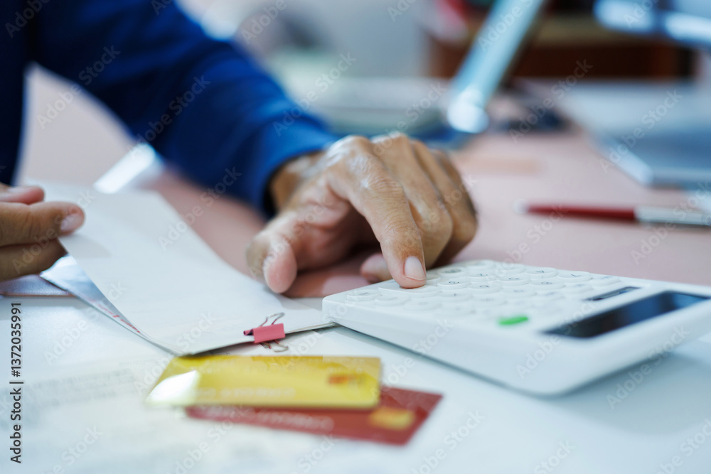 asian man calculate monthly expenses from receipt and many bill of ...