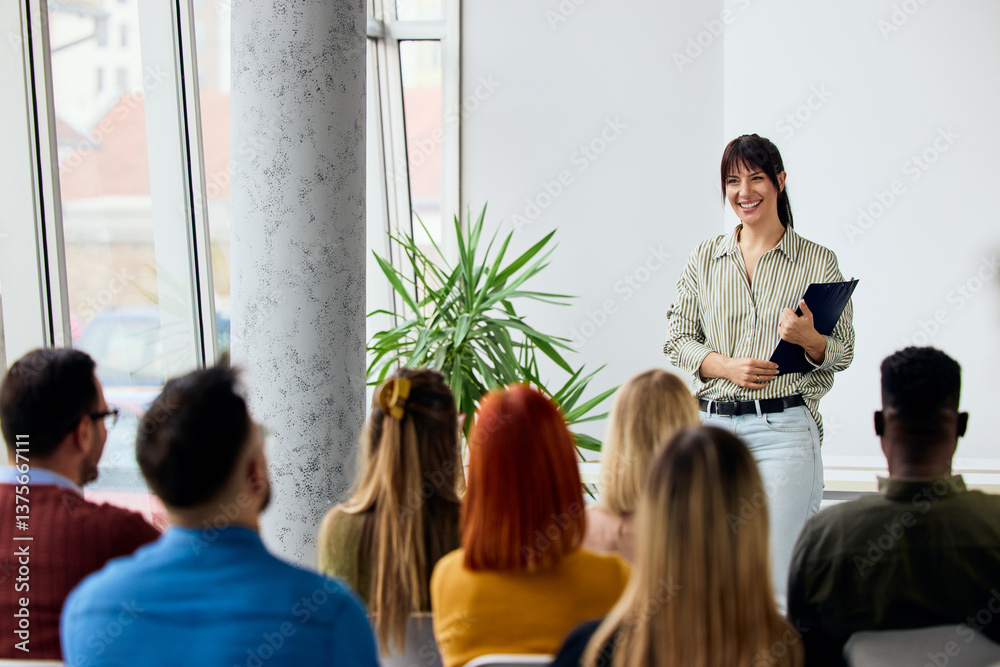 Speaker Engaging an Audience During a Training Session in a Modern ...