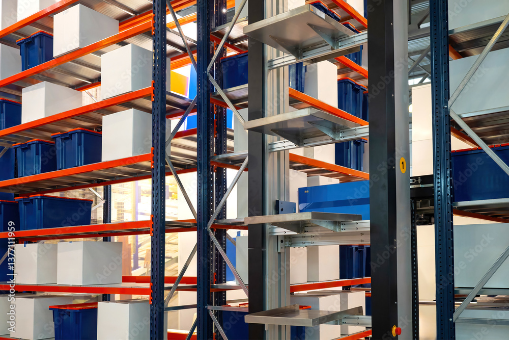 Automated warehouse racks. Metal shelves with containers. Vertical ...