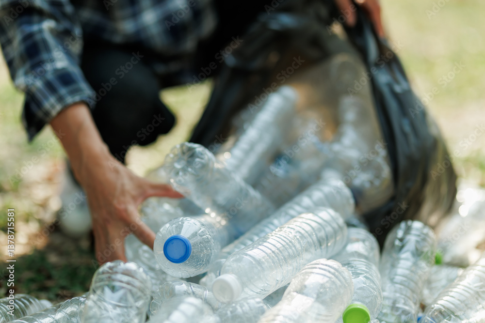 Collecting plastic bottle waste for recycling to help reduce pollution ...