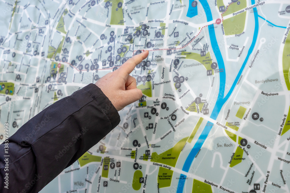 Poznan, Poland - March 15, 2025: man pointing at central part of poznan ...