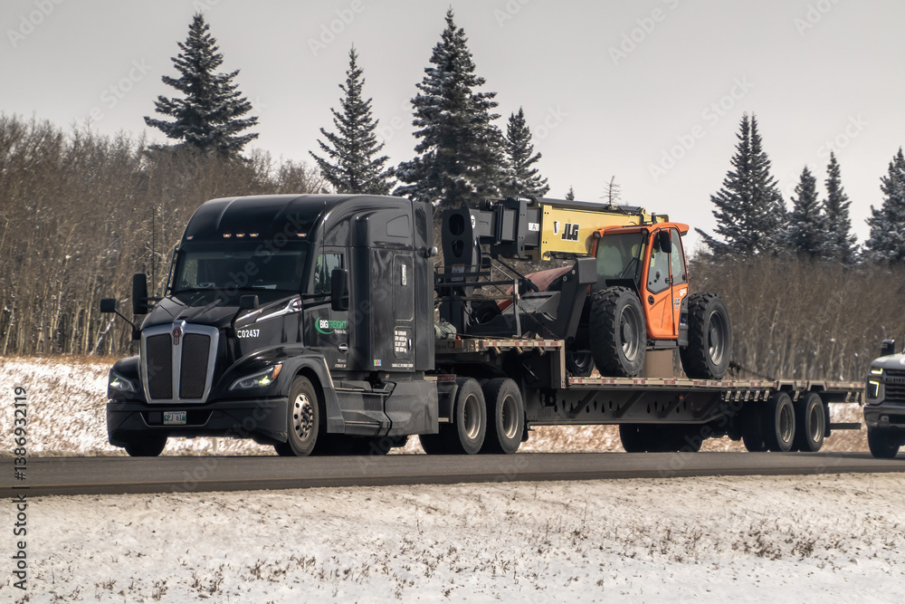 Calgary, Alberta, Canada. Apr 4, 2025. A black Kenworth T680 semi-truck ...