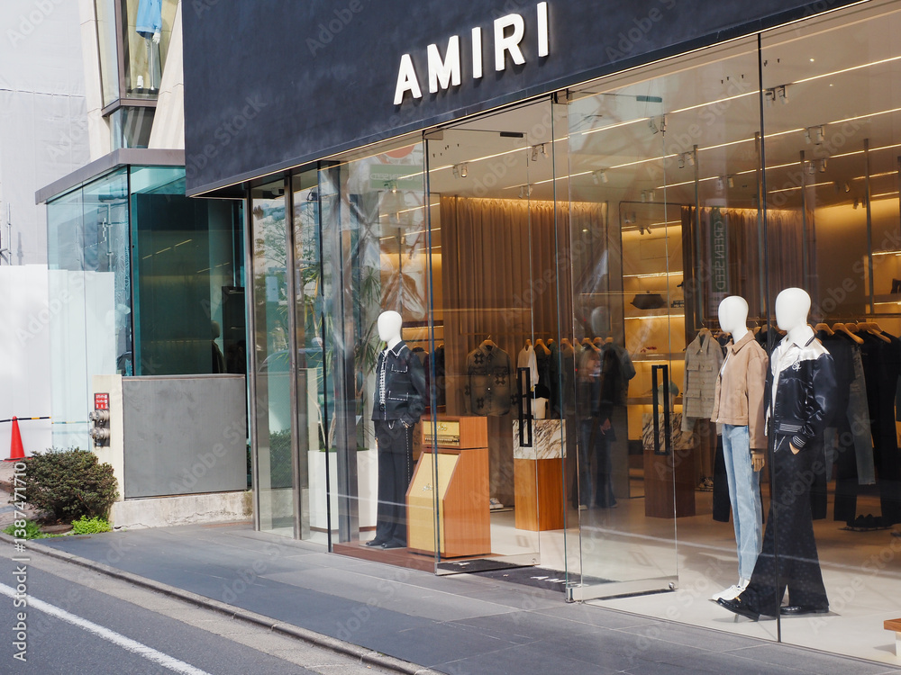 TOKYO, JAPAN - April 5, 2025: Display in the window of an Amiri store ...