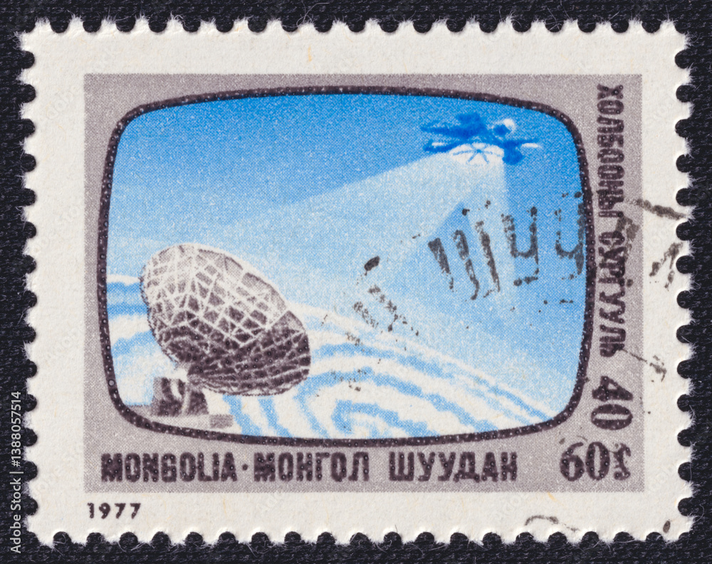 Mongolian postage stamp issued in 1977 shows a satellite transmitting ...