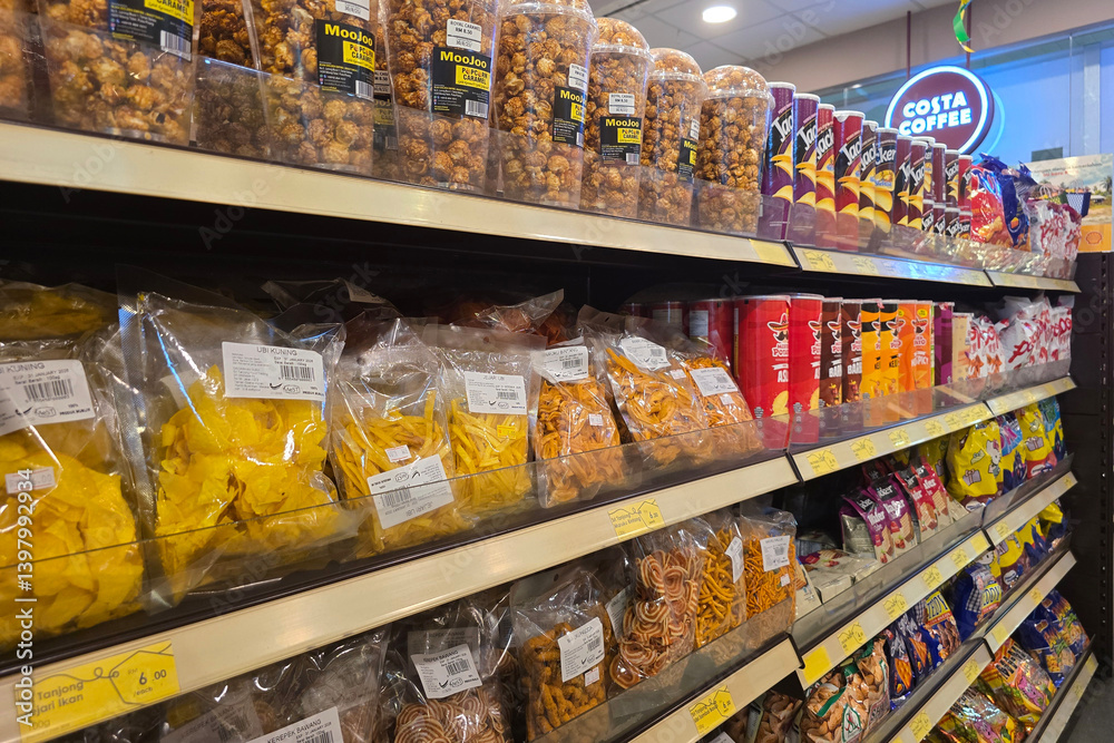 Penang, Malaysia - Mar 26, 2025: A diverse selection of snacks ...