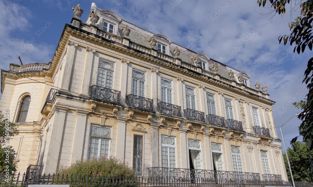 Beautiful colorful yellow opulent luxury mansion building on Paseo de ...
