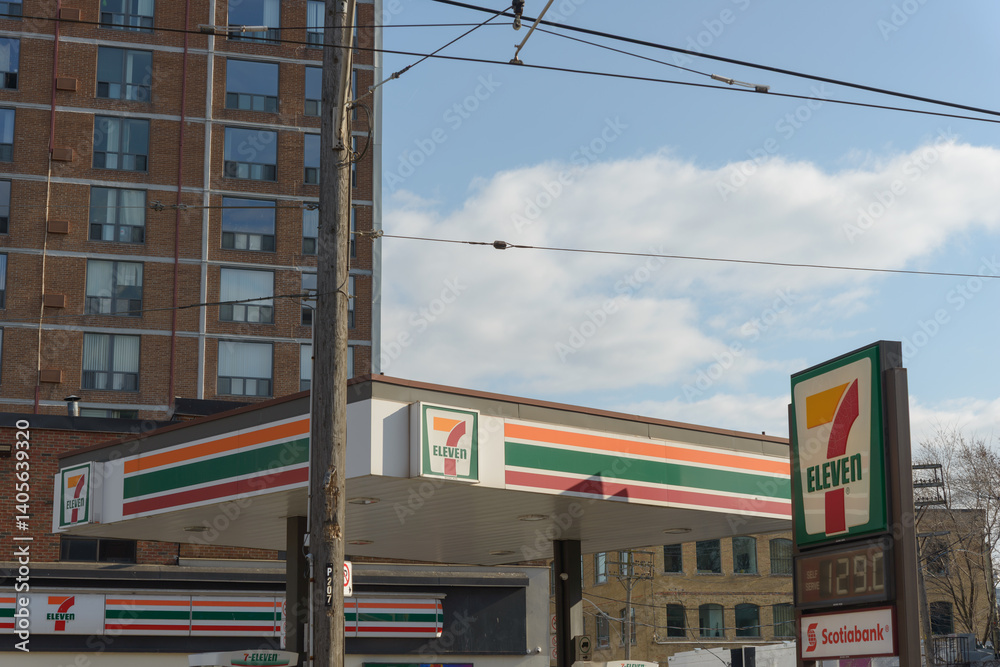 exterior building facade and sign of 7-Eleven, a convenience store ...