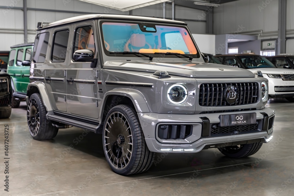 Mercedes G-Class G63 with Brabus tuning and custom wheels in dealership ...