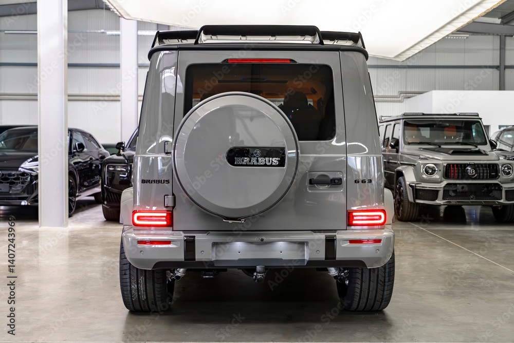 Mercedes G-Class G63 with Brabus tuning and custom wheels in dealership ...
