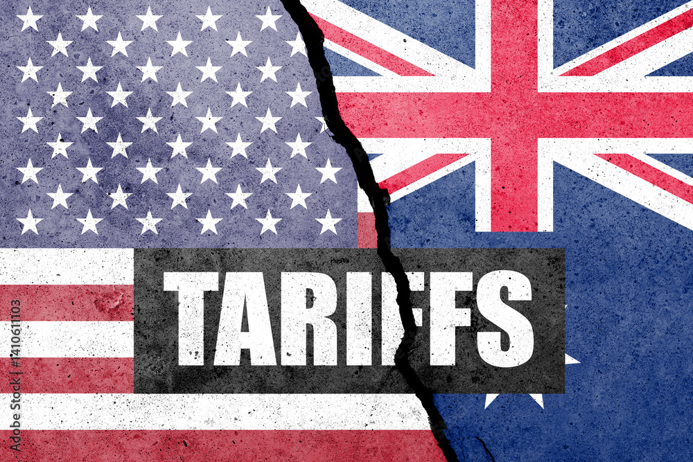 USA and Australia flags painted on the concrete wall with word TARIFFS ...