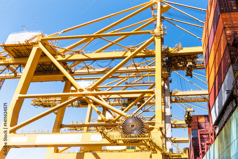Huge gantry crane above the container ship during cargo operation ...