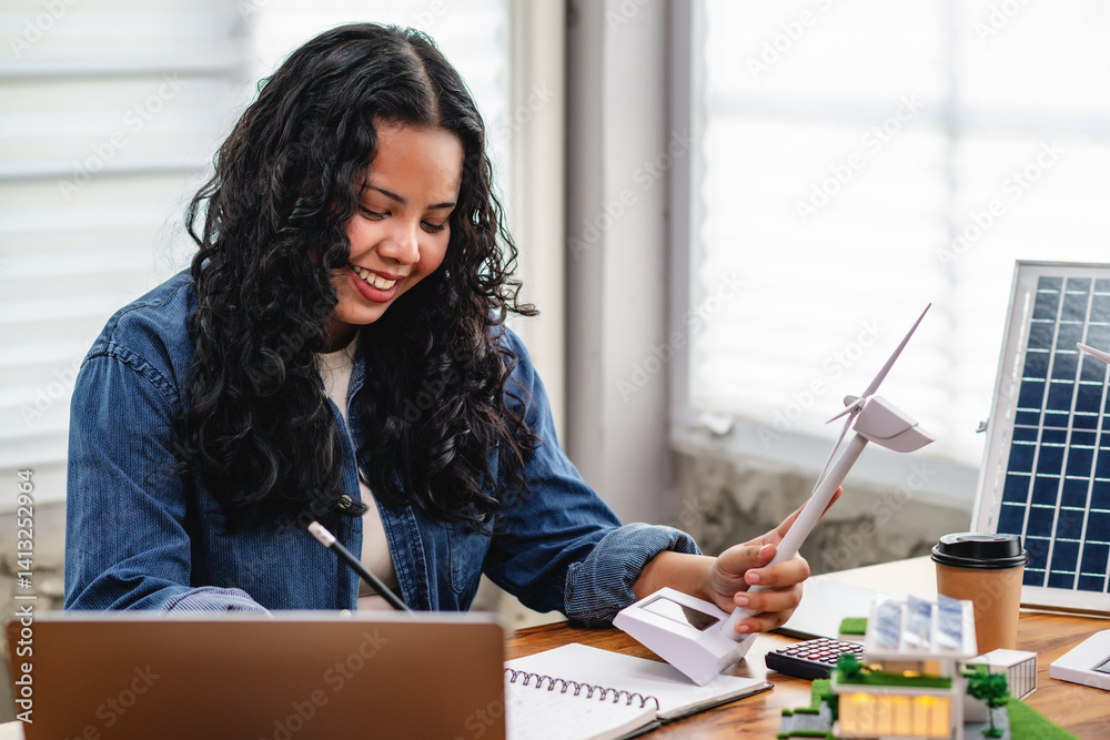 Female architect analyzes energy efficiency by calculating solar panel ...