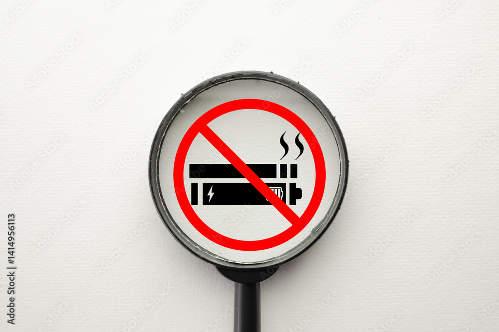 No vaping and no smoking sign under magnifying glass over white ...