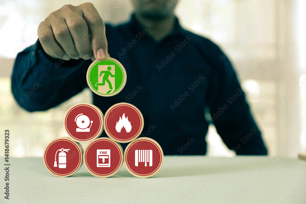 Hand chooses door exit sing on wooden toy stack for fire escape to ...