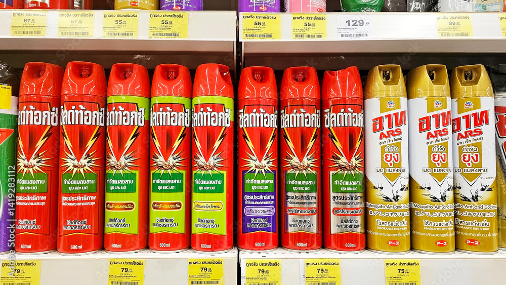 Insecticide Display: A row of vividly colored insecticide spray bottles ...