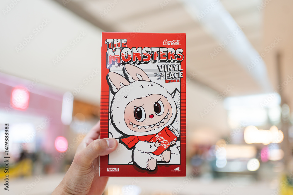 KUALA LUMPUR, MALAYSIA - MAR 30, 2025: Hand holding The Monster Labubu ...