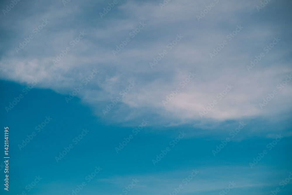 Blue water stretches to the horizon where sea and sky meet, clouds ...