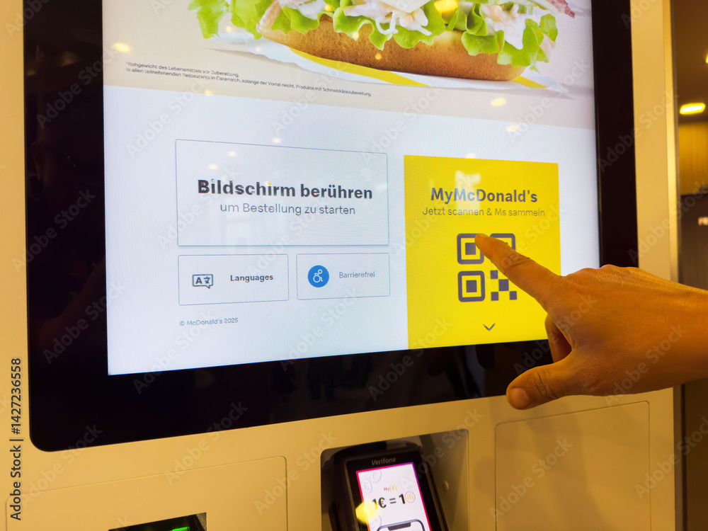Touchscreen ordering at fast food restaurant kiosk with qr code and ...