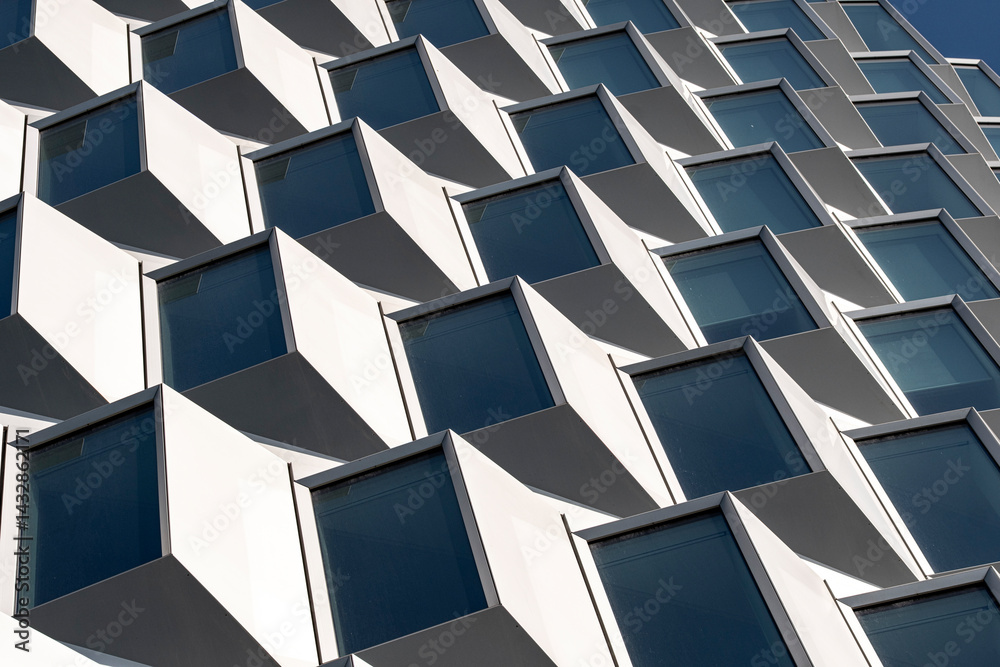 Patterned white windows forming a 3D optical texture on a minimalist ...