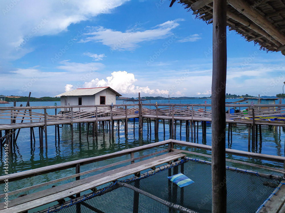 Coastal water village scene with wooden platforms, Batam, Indonesia ...