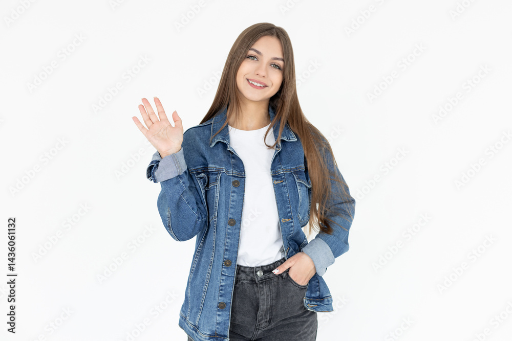 Cheerful friendly girl saying hello, winking and smiling, waving hand ...