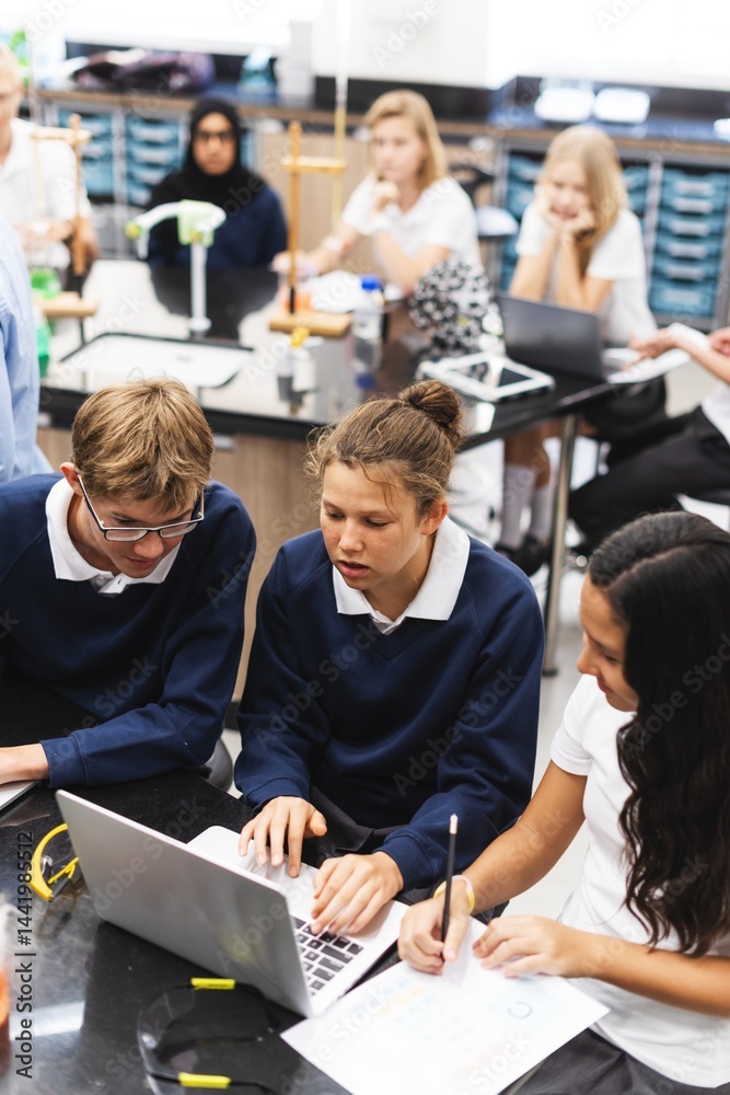 Students in a science class collaborate on a project. Diverse group of ...