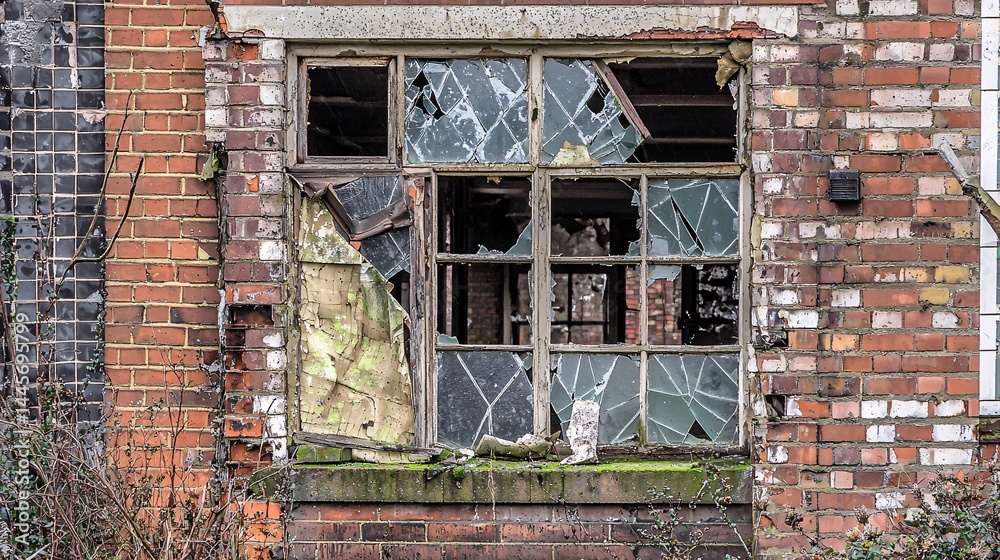 window in abandoned house in suburban neighborhood, no surveillance or ...