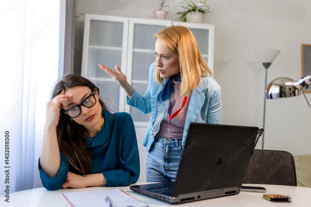 Woman yelling at a colleague in an office, showing workplace bullying ...
