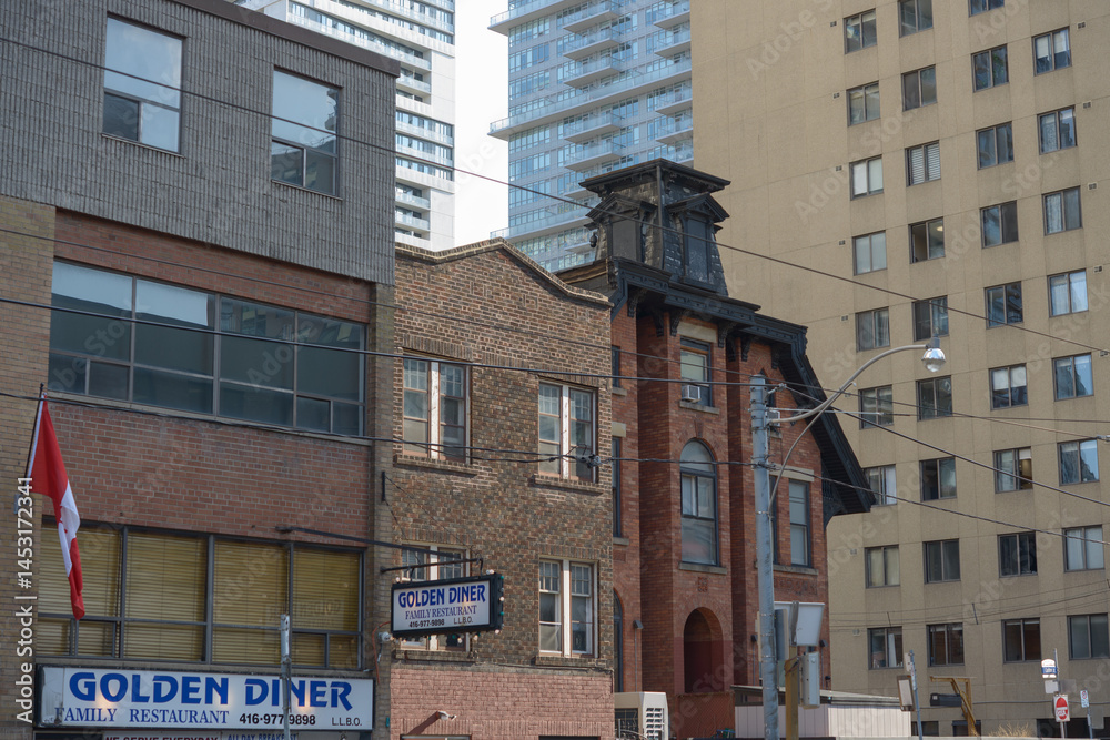 mix of architectural styles and sign of Golden Diner, a family-owned ...