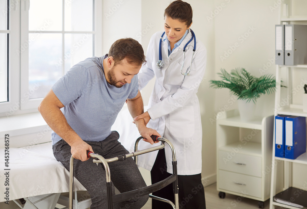 Friendly female doctor assisting male patient with walkers in medical ...