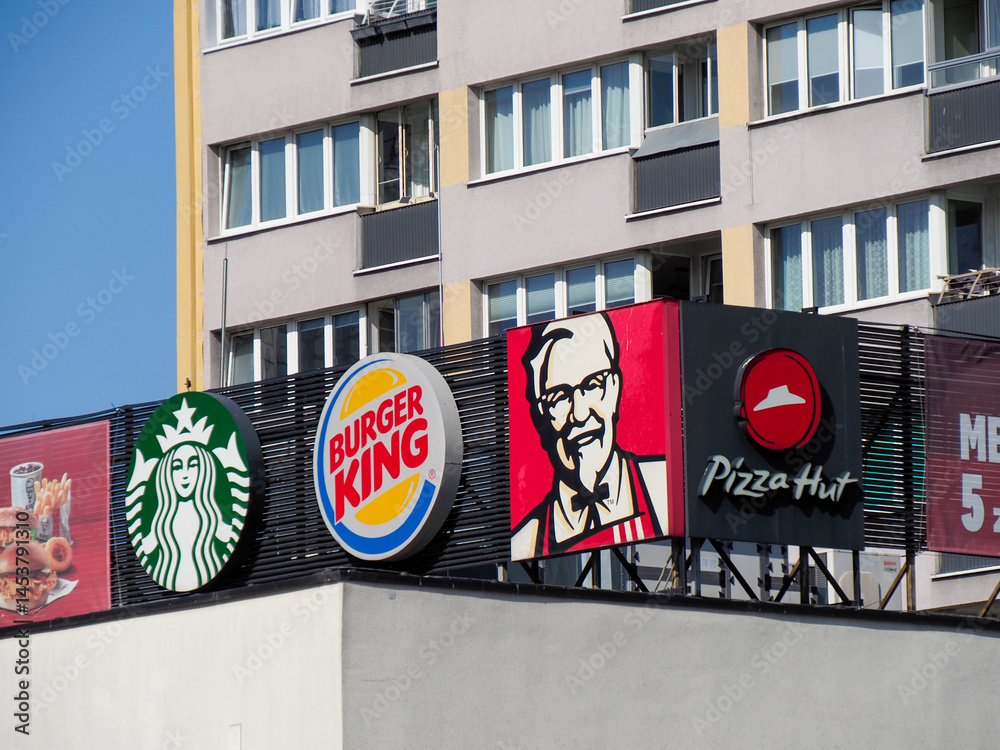 Row of International Fast Food Chain Signs with Starbucks, Burger King ...