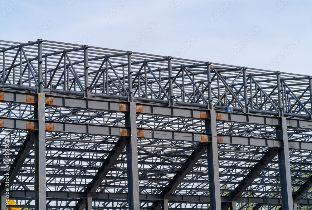 Steel frame grid of exterior walls and arched roof structure of a ...