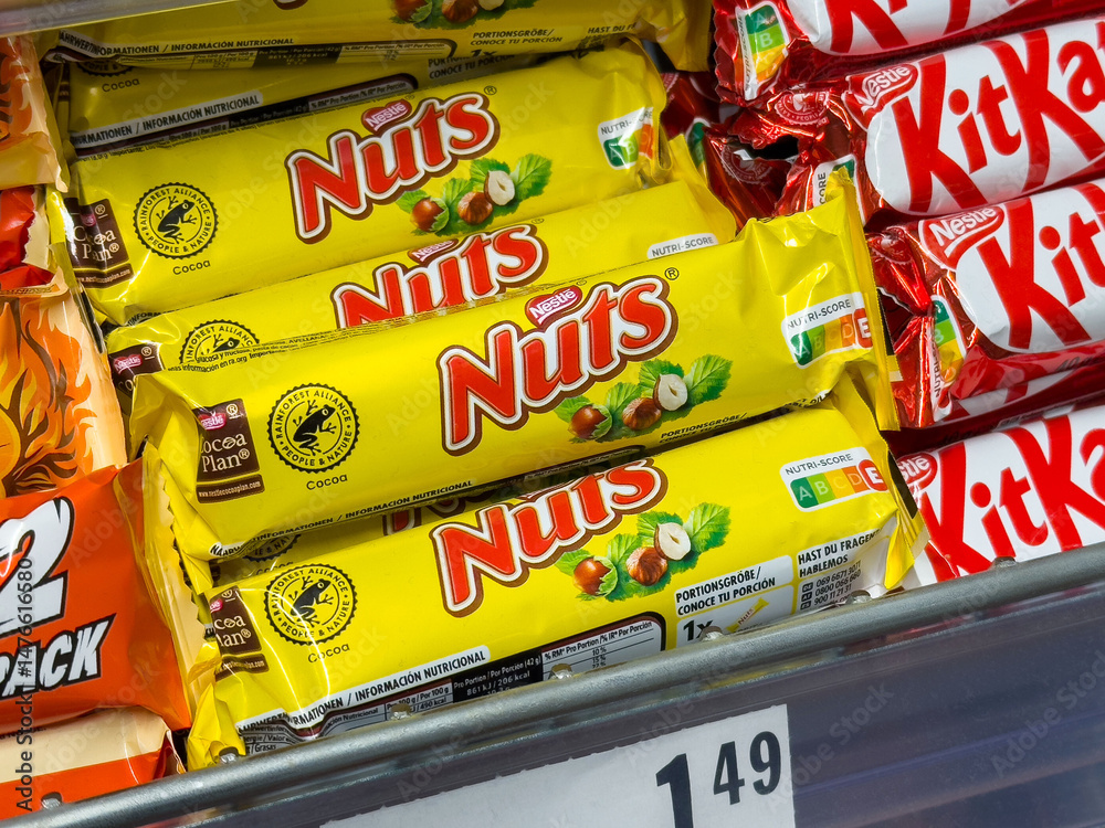 Nestle nuts chocolate bars on supermarket shelf with price tag Stock Photo | Adobe Stock