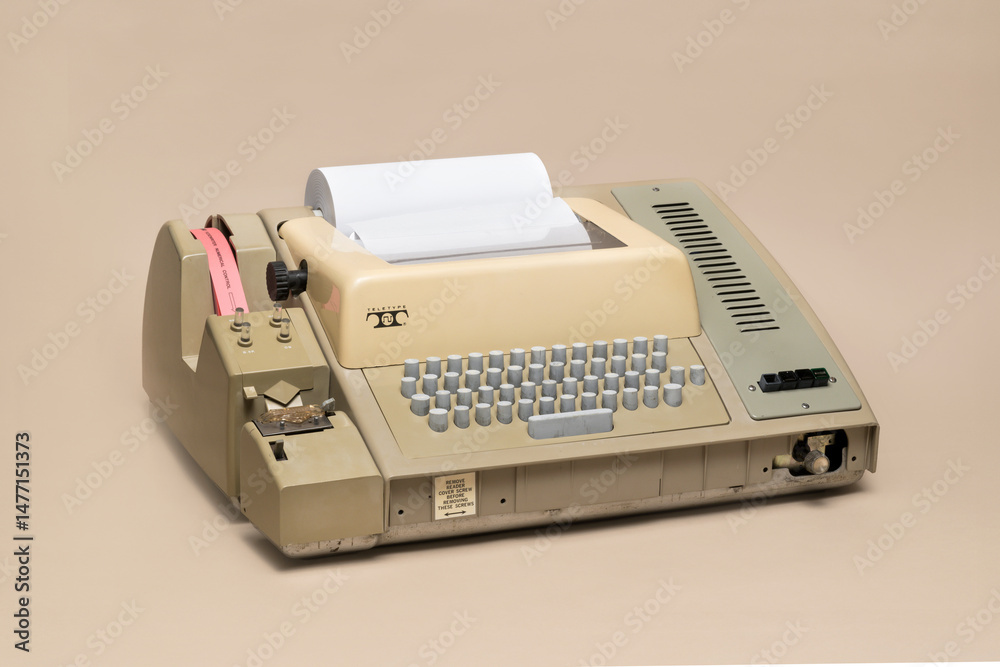 Pavia, Lombardy, Italy - March 13, 2025: Teletype Model 33 teleprinter, introduced in 1963. It ...