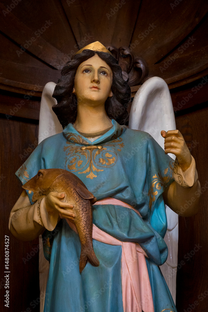 Statue (19th century) of Archangel Raphael, chief guardian angel and ...