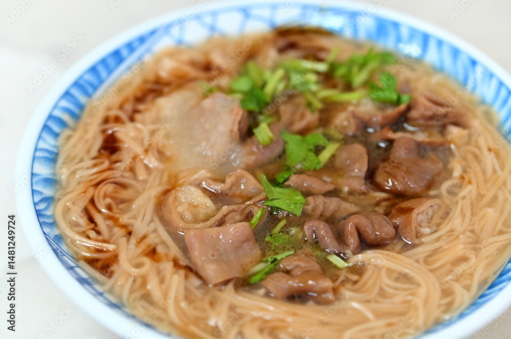 Authentic Taiwanese Mee Sua with pork intestines in close-up, showing ...