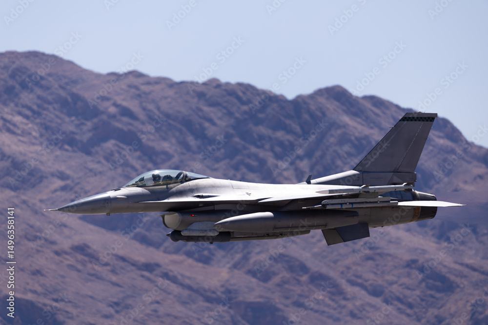 Side view of a F-16 Fighting Falcon against the Nevada hills Stock ...